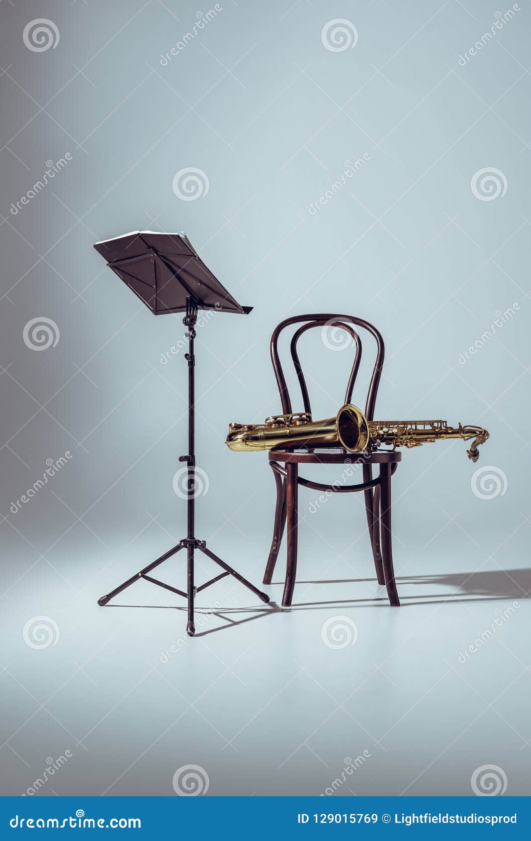 Music Stand for Notes and Professional Saxophone on Chair Stock Image ...