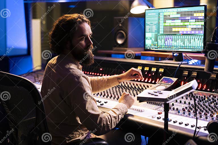 Music Technician Mixing and Mastering Songs with Motorized Faders and ...