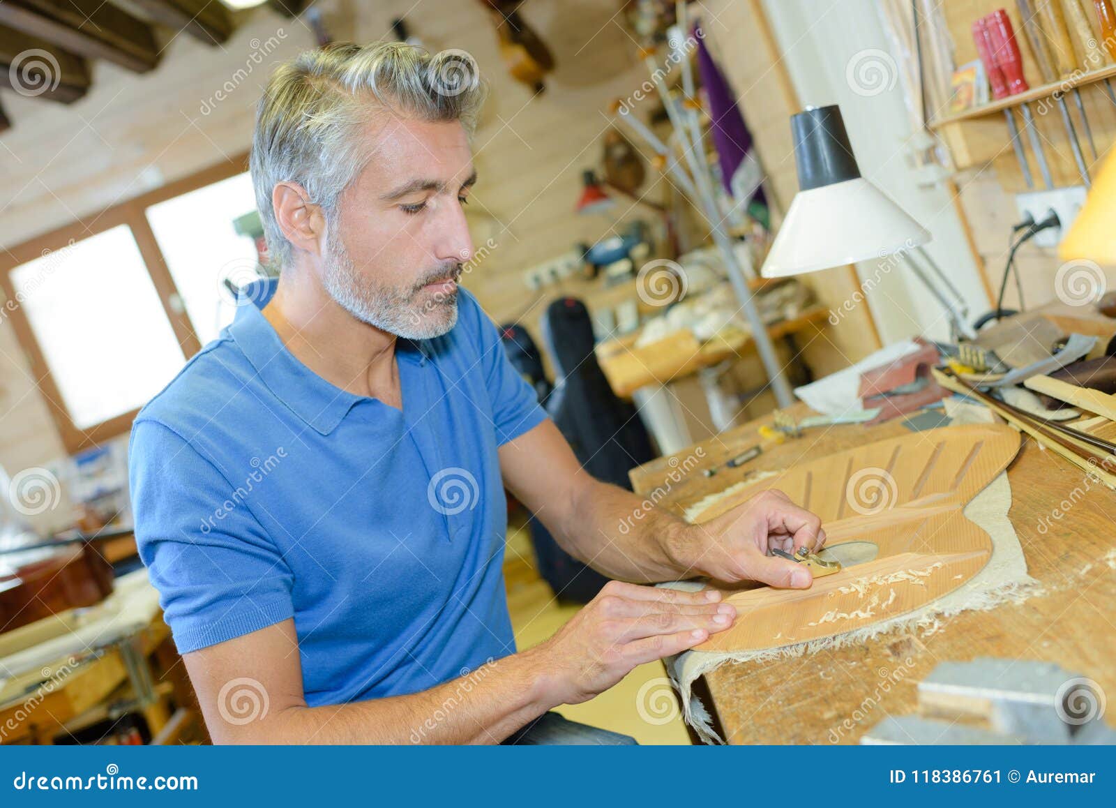 Musical Instrument Maker at Workbench Stock Image - Image of ...