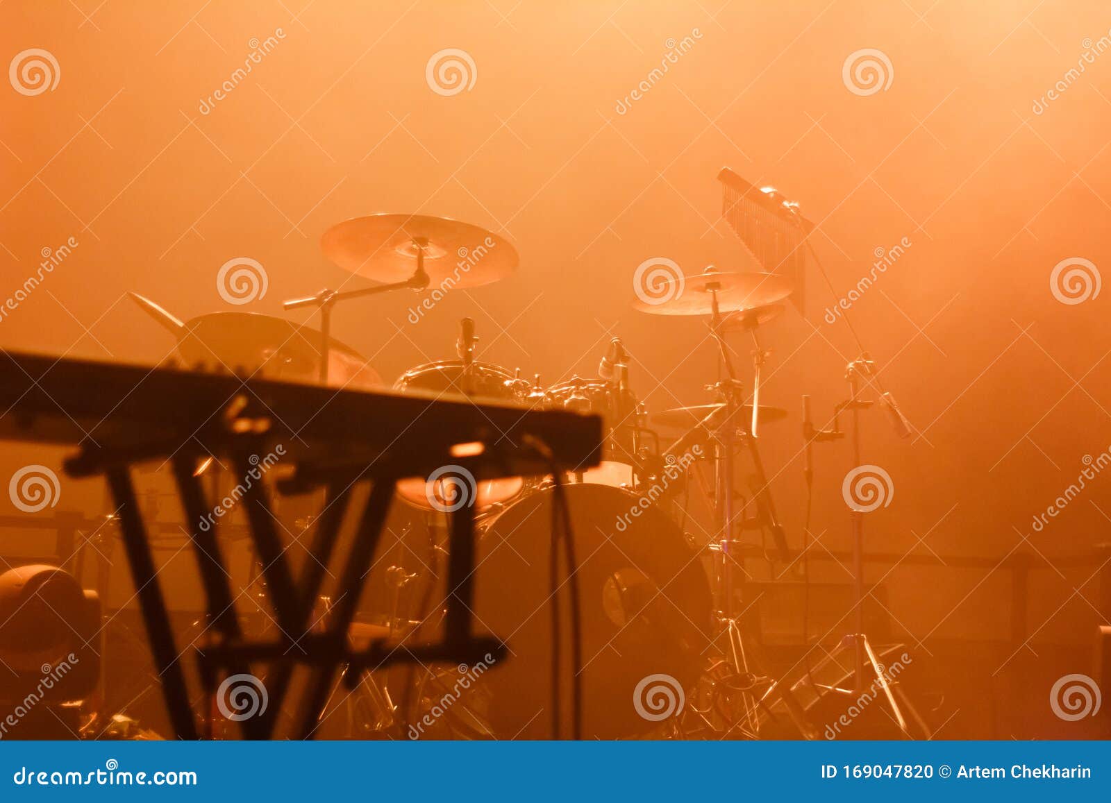 Musical Instruments on the Stage Filled with Orange Light Stock Photo ...