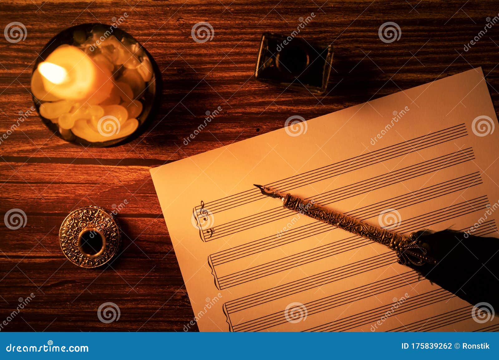 Musical Notes Sheet with Vintage Feather Quill Pen in Candlelight Stock ...