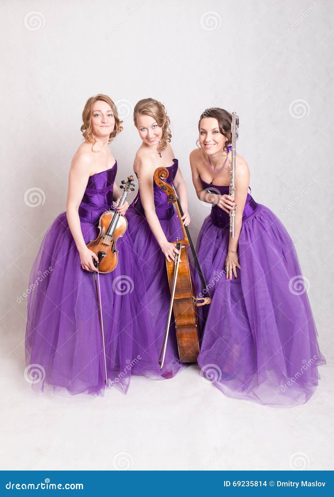 Musical Trio in Purple Dresses Stock Photo - Image of fashion, flute ...
