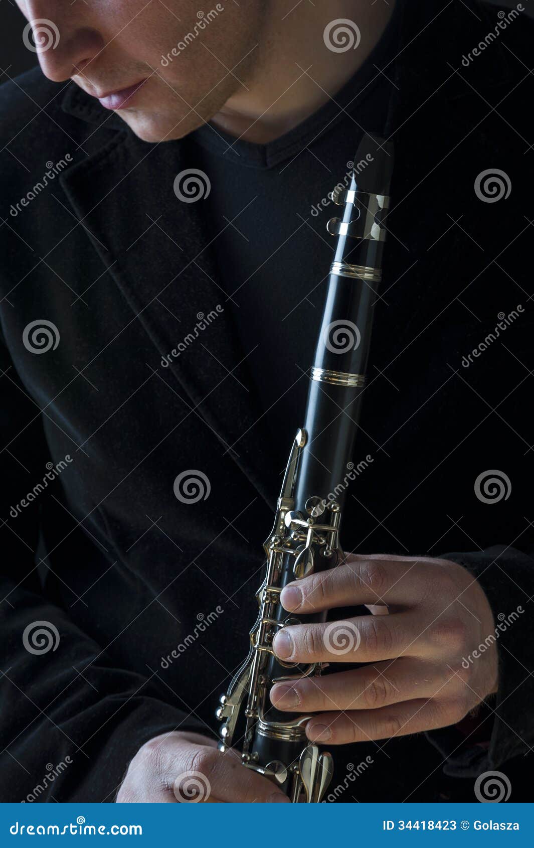 Musician and clarinet stock image. Image of hold, clarinet - 34418423