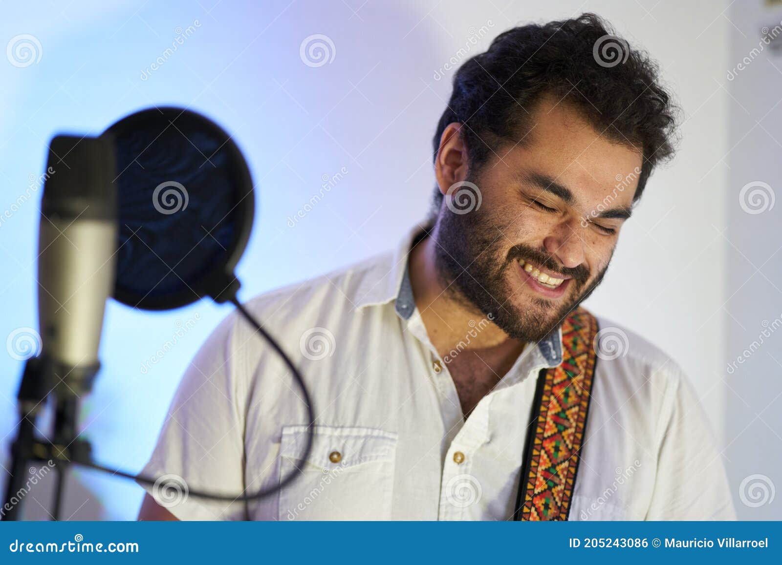 Musician Singing in Front of the Microphone in Studio Stock Photo ...