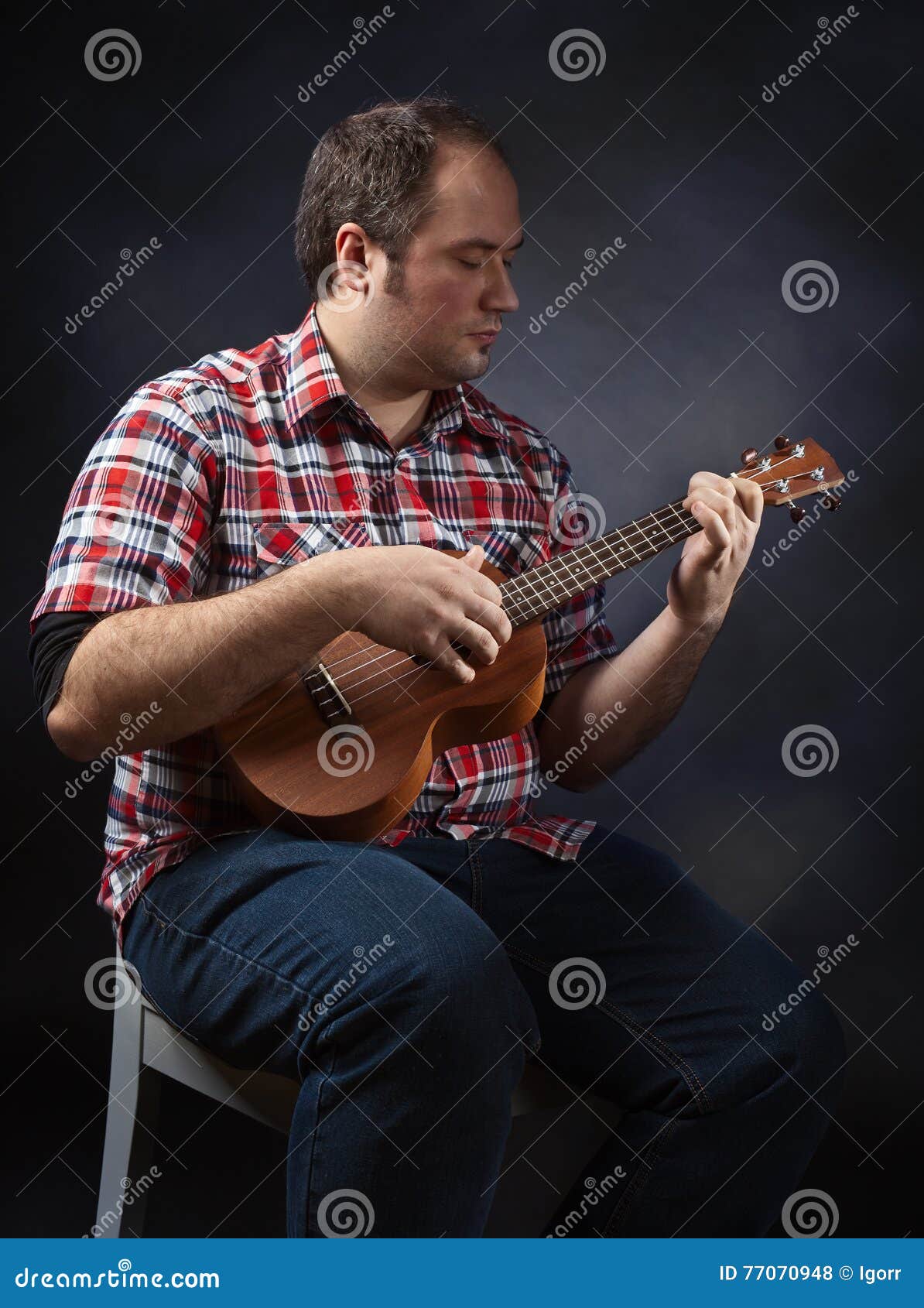 Musician with ukulele stock photo. Image of black, play - 77070948