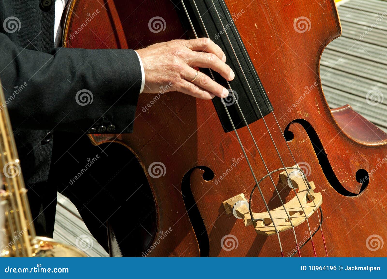 Musicians Playing Instruments in the Sun Stock Photo - Image of bass ...