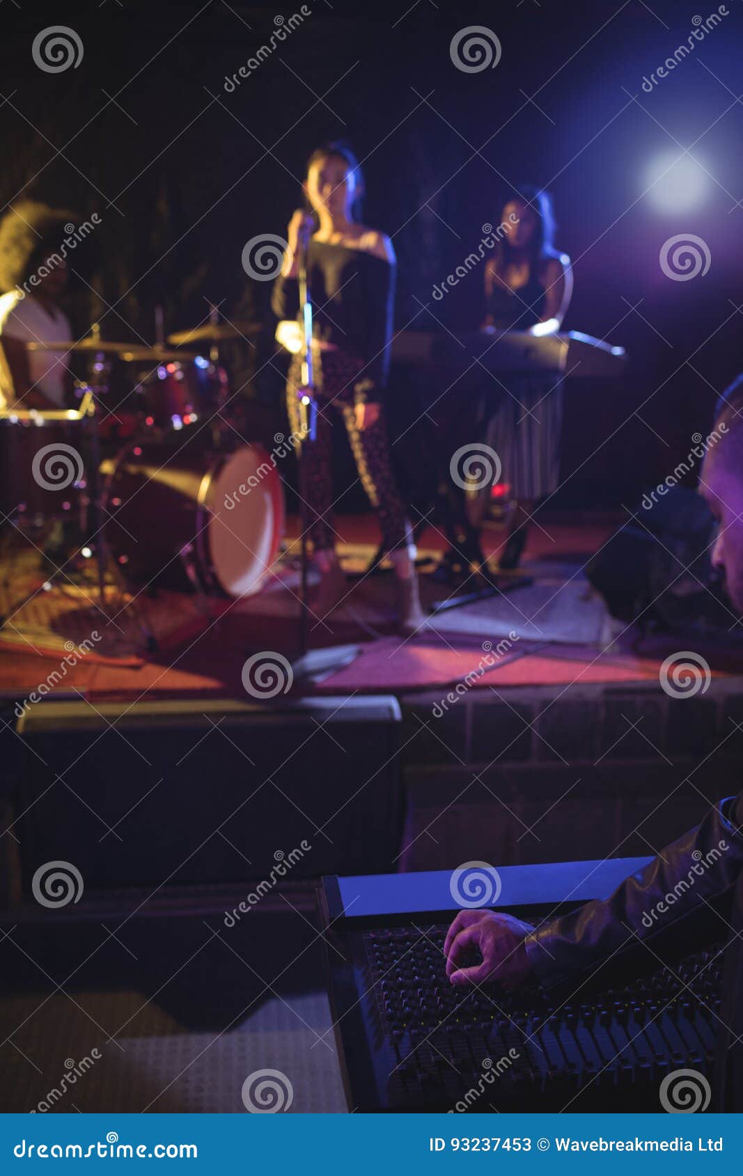 Musicians and Singer Performing on Illuminated Stage in Nightclub Stock ...