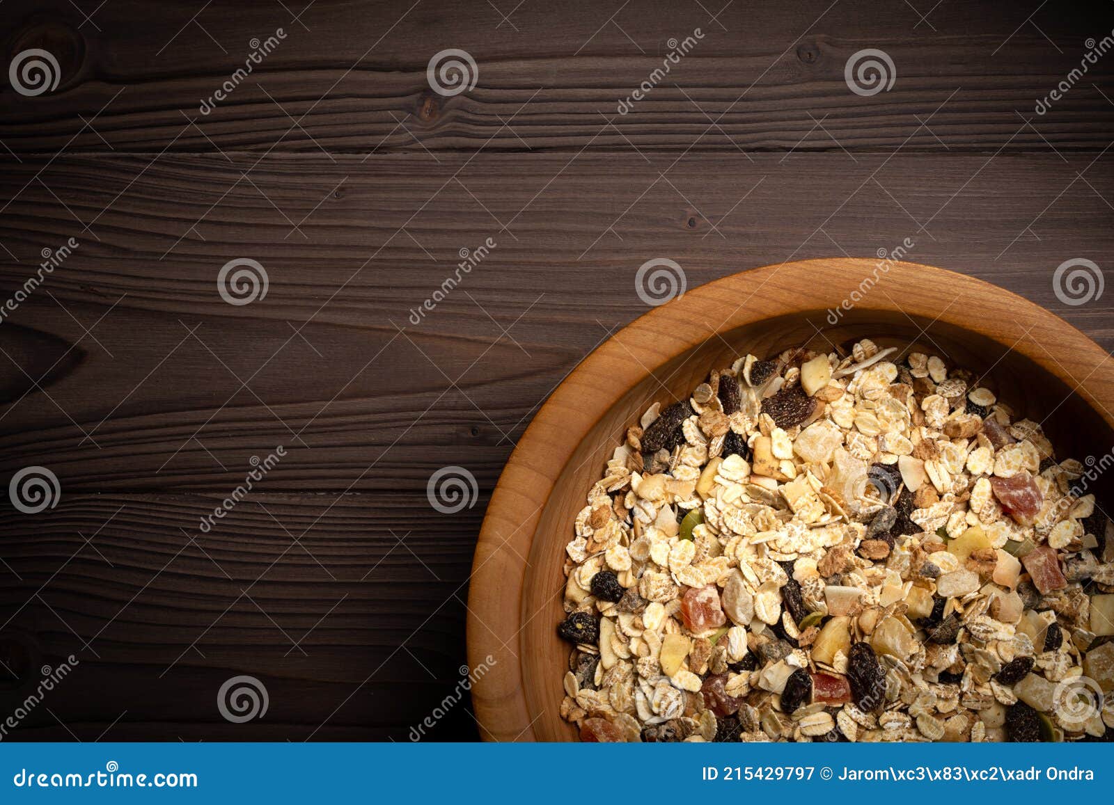 Musli in a wooden bowl stock image. Image of food, oatmeal - 215429797