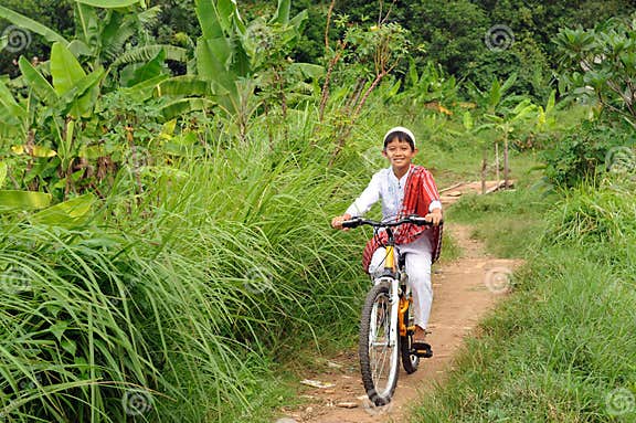 Muslim Boy Riding Bicycle stock photo. Image of bicycling - 13175994