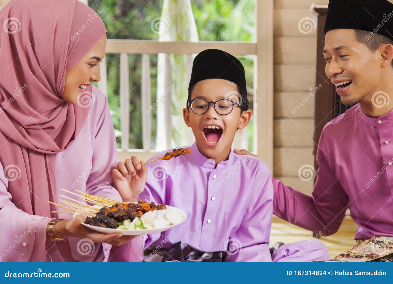 Muslim Family Feasting during the Eid Celebration Stock Photo - Image ...