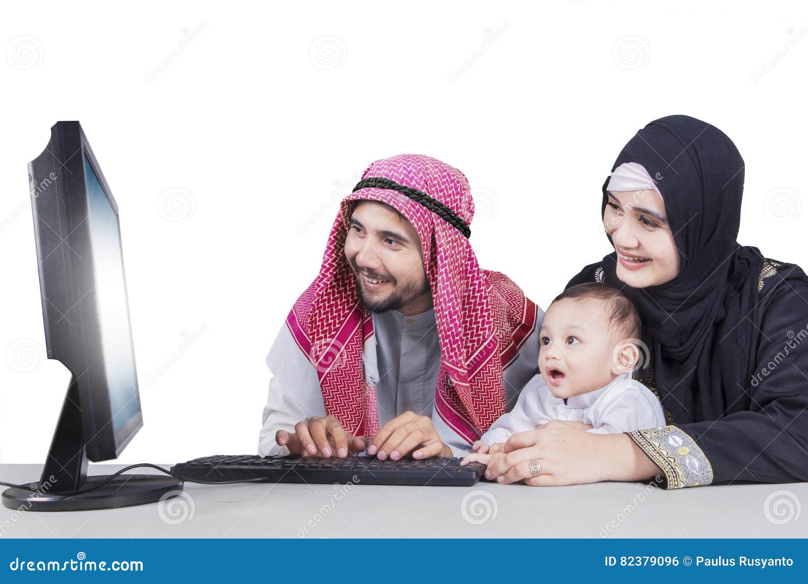 Muslim Family Using a Computer on Studio Stock Photo - Image of ...