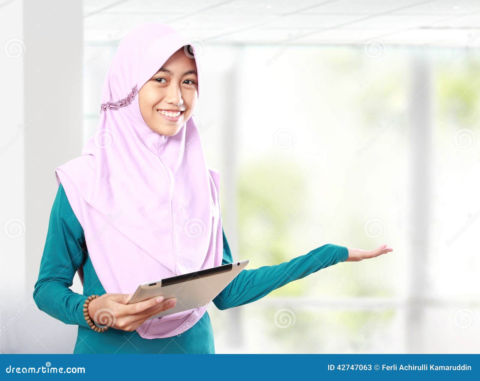 Muslim Girl with Tablet Computer Presenting Stock Image - Image of ...