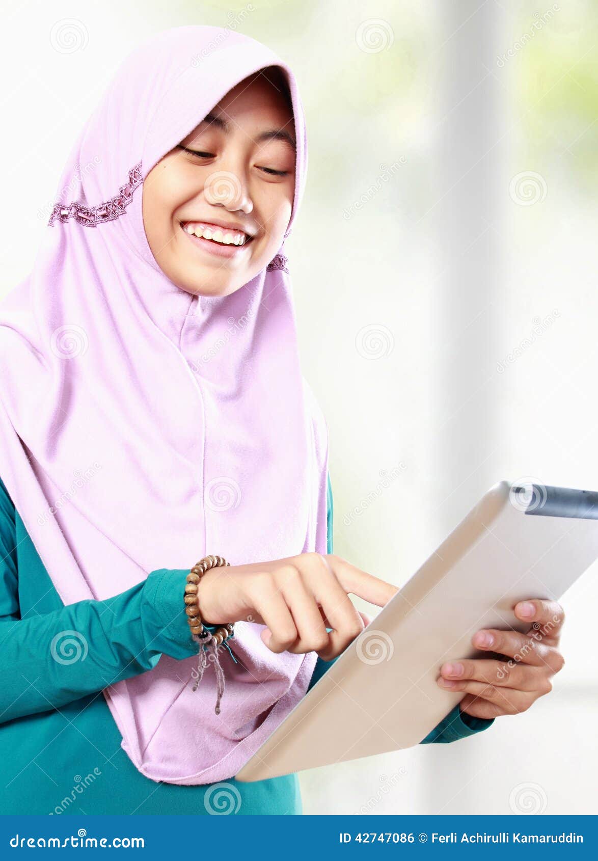 Muslim Girl Using Tablet Computer Stock Photo - Image of computer ...