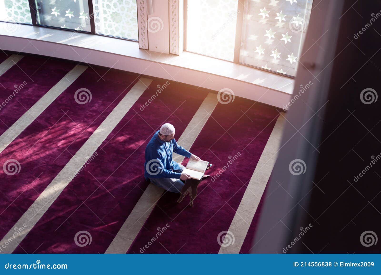 Muslim Man Reading Holy Book Qur`an Inside the Mosque Stock Photo ...