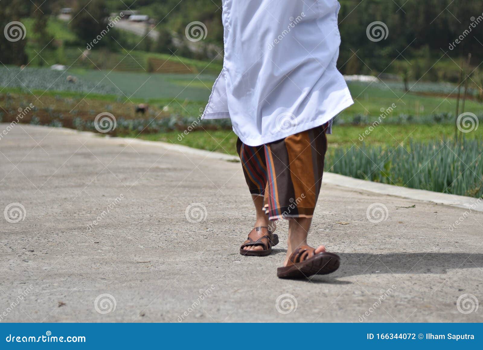 Muslim Men Wearing Sarong are Walking Stock Photo - Image of beads ...