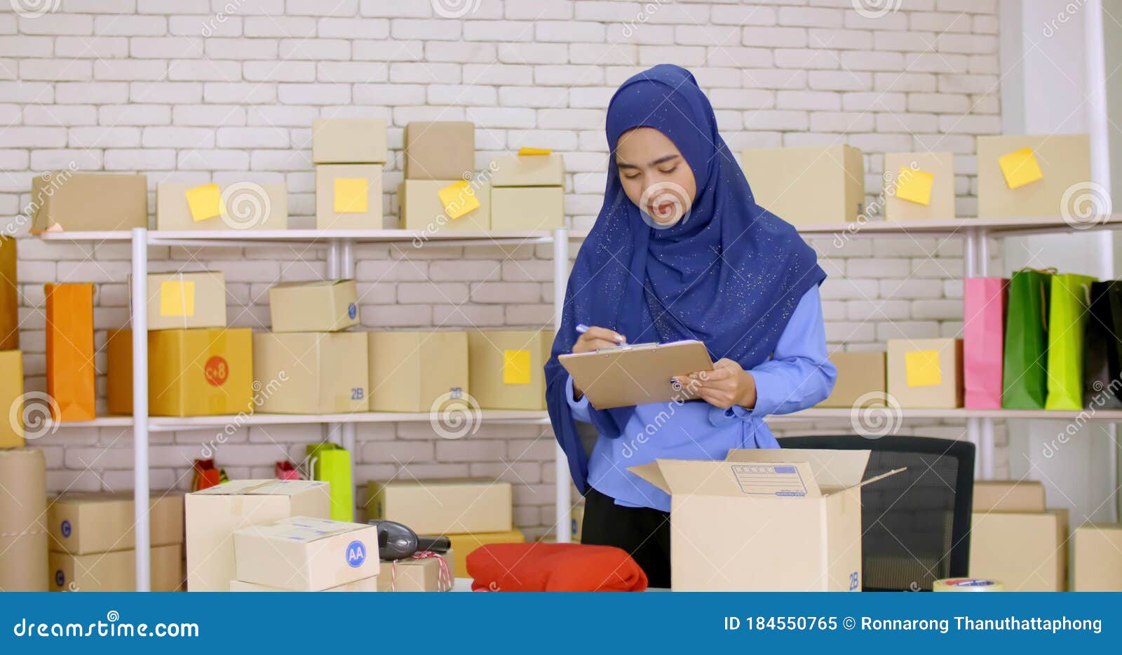 Muslim Merchandiser Checking Order in the Office Stock Image - Image of ...