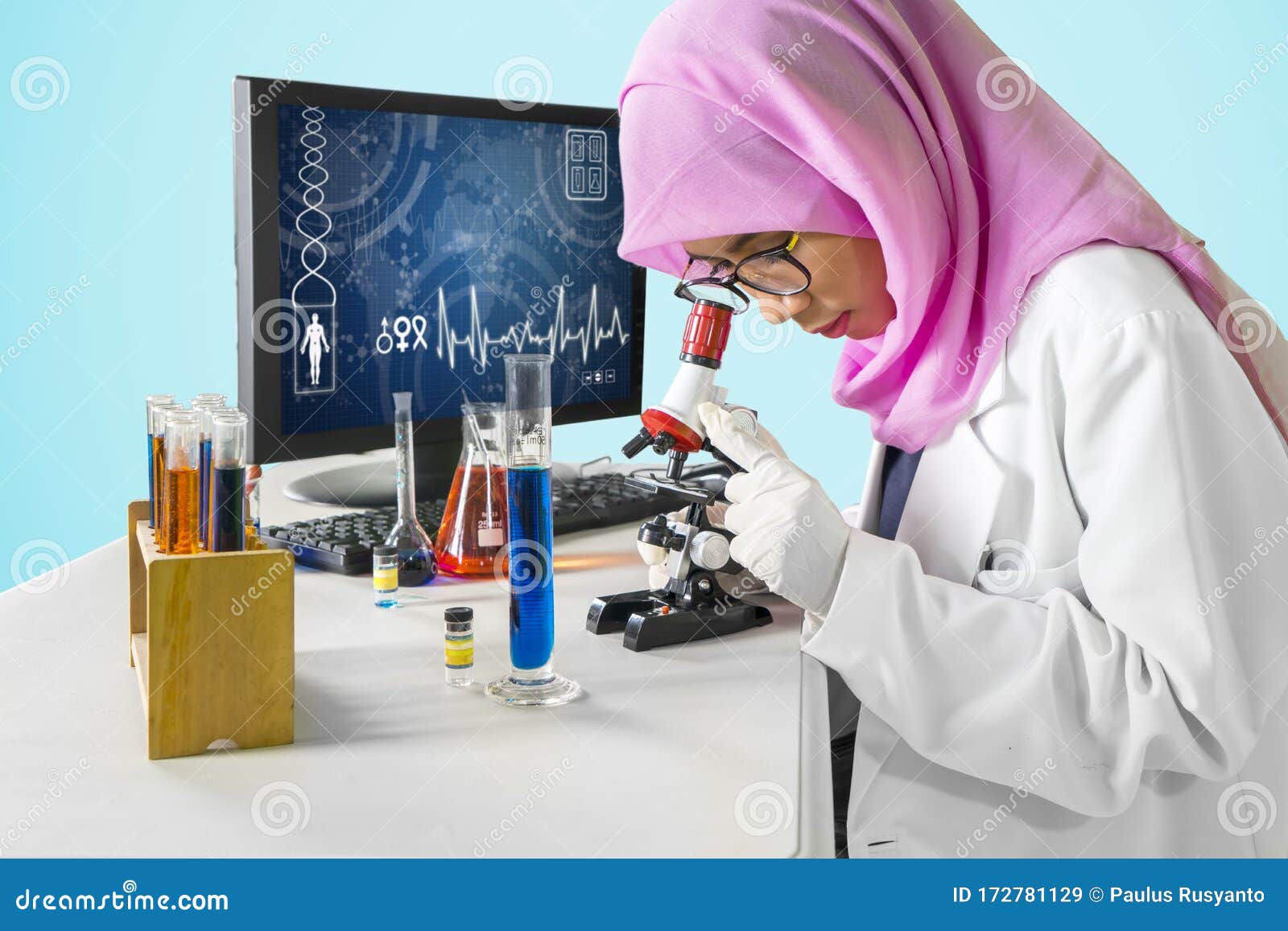 Muslim Scientist Doing Experiment with Microscope Stock Image - Image ...