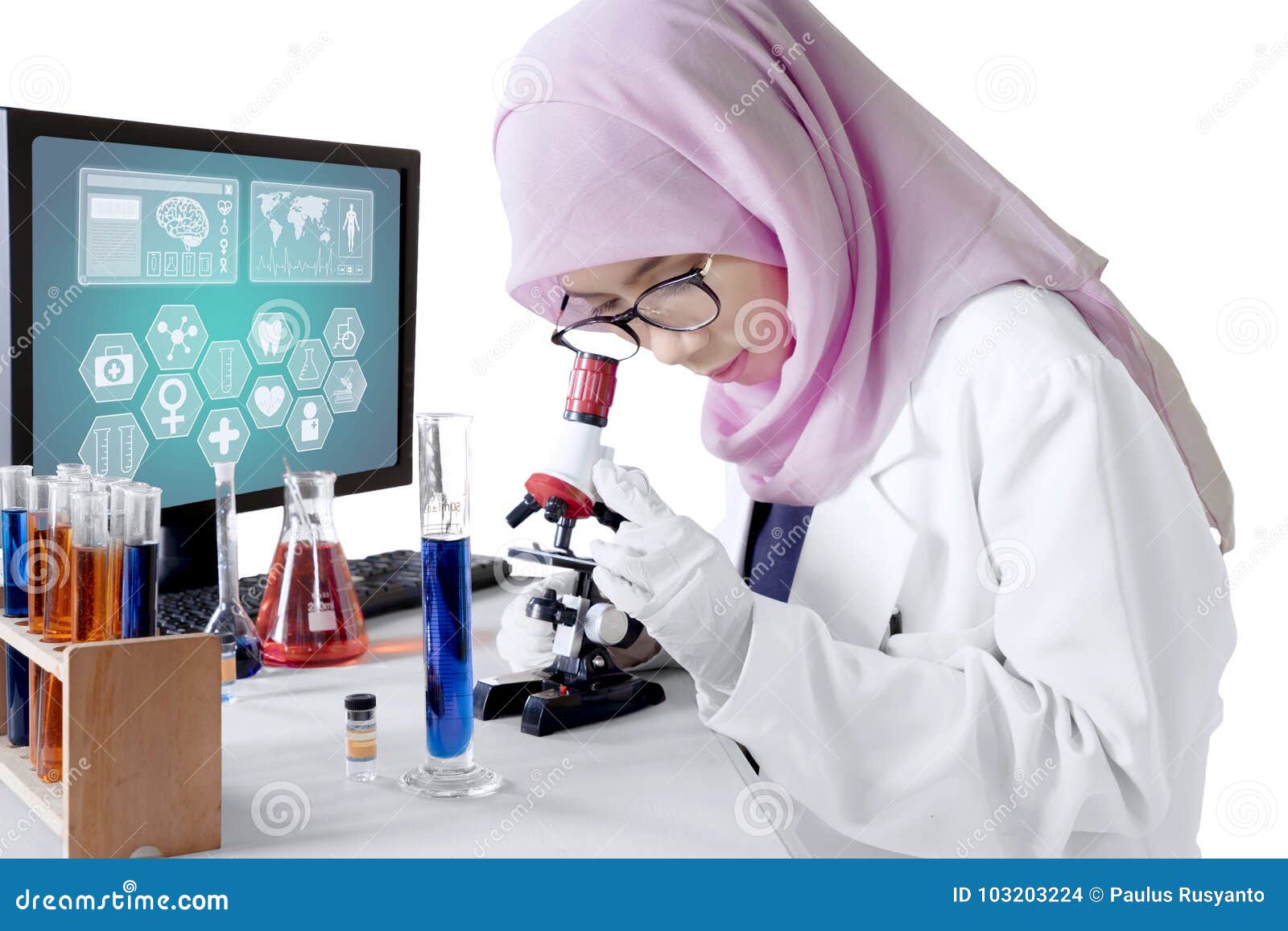 Muslim Scientist Looking through a Microscope Stock Photo - Image of ...