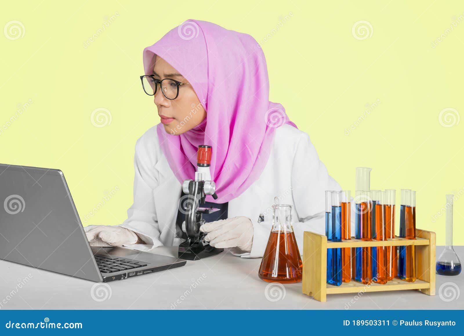 Muslim Scientist Using Laptop and Microscope Stock Image - Image of ...
