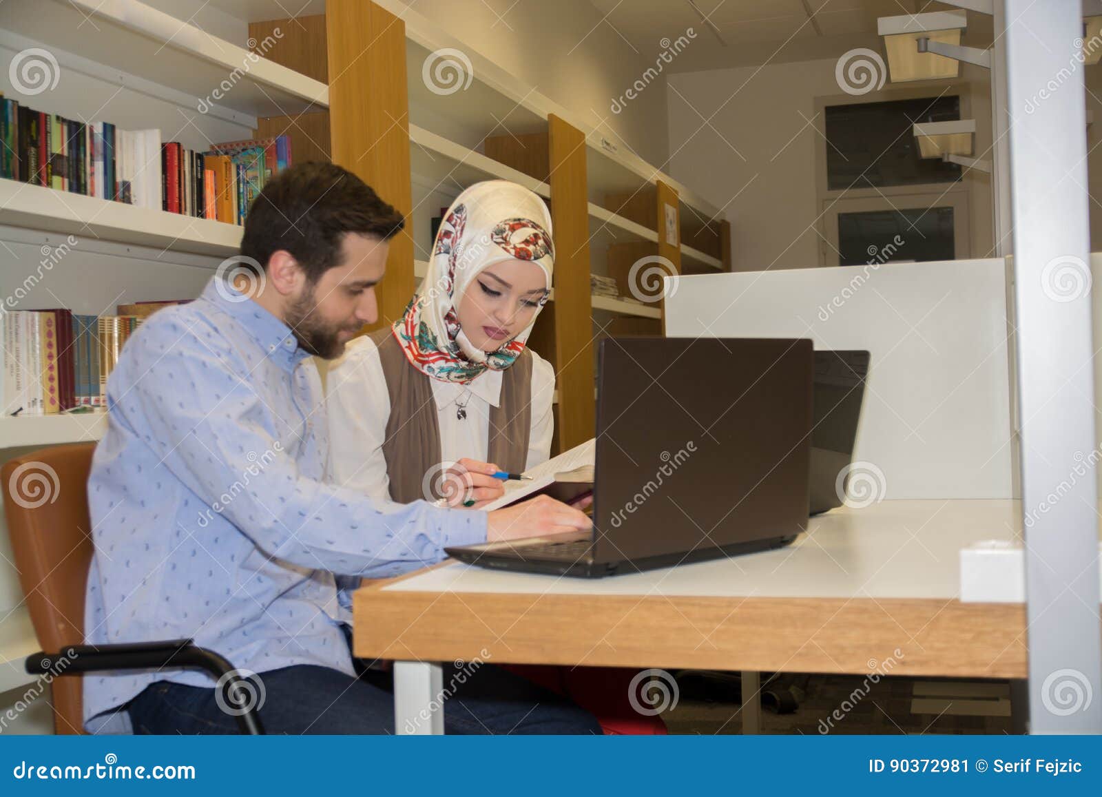 Muslim students in library stock image. Image of exam - 90372981