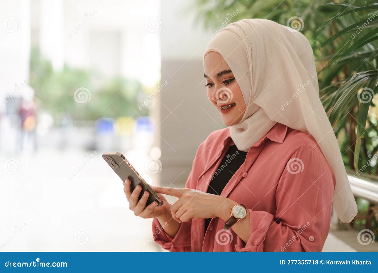 A Muslim in White Hijab University Student Seated Inside a Campus ...