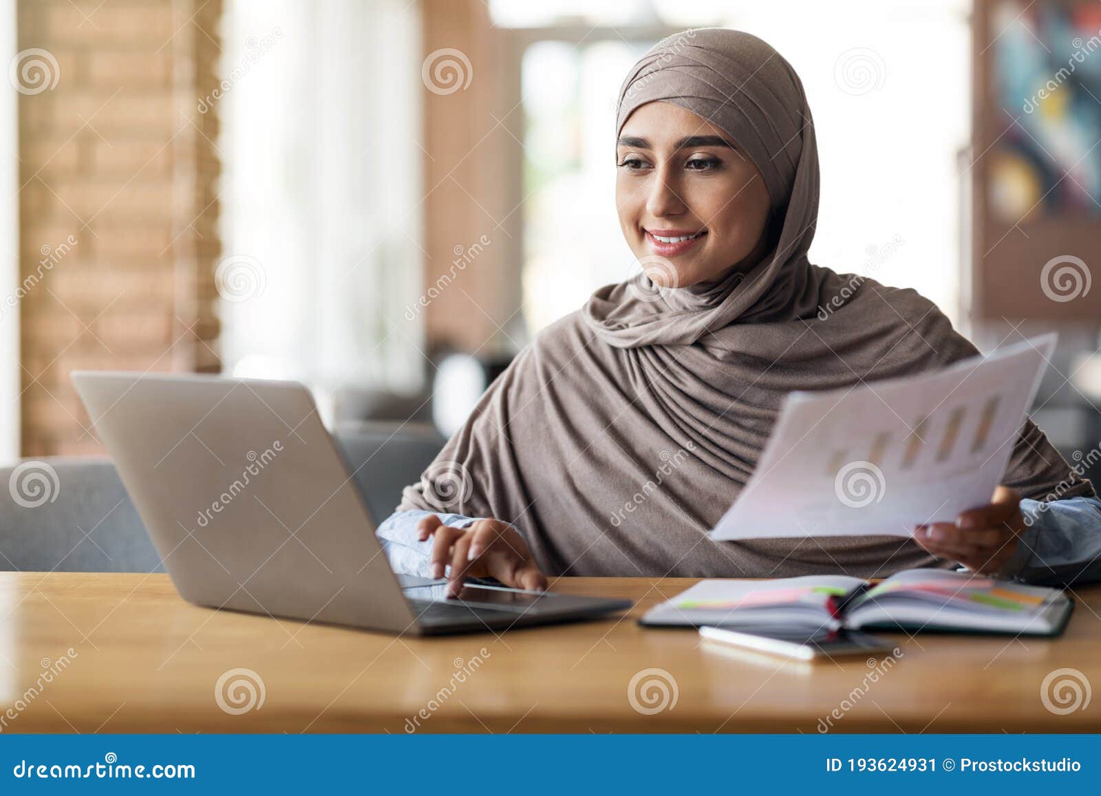 Muslim Woman Business Analyst Working on Laptop at Cafe Stock Image ... Muslim Woman Business Analyst Working on Laptop at Cafe Stock Image ...