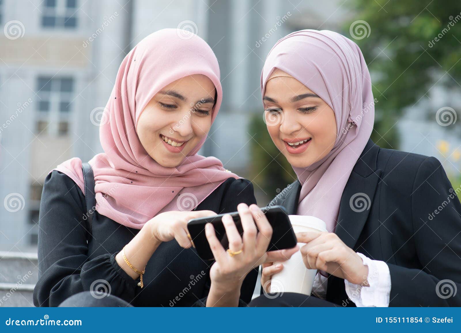 Muslim Women Using Smart Phone Stock Photo - Image of cell ...