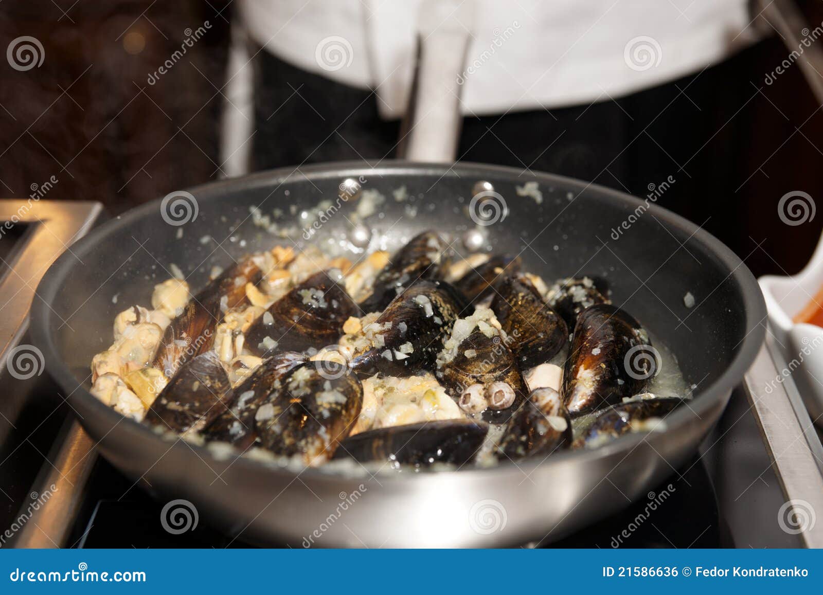 Mussels being fried in pan stock photo. Image of commercial - 21586636
