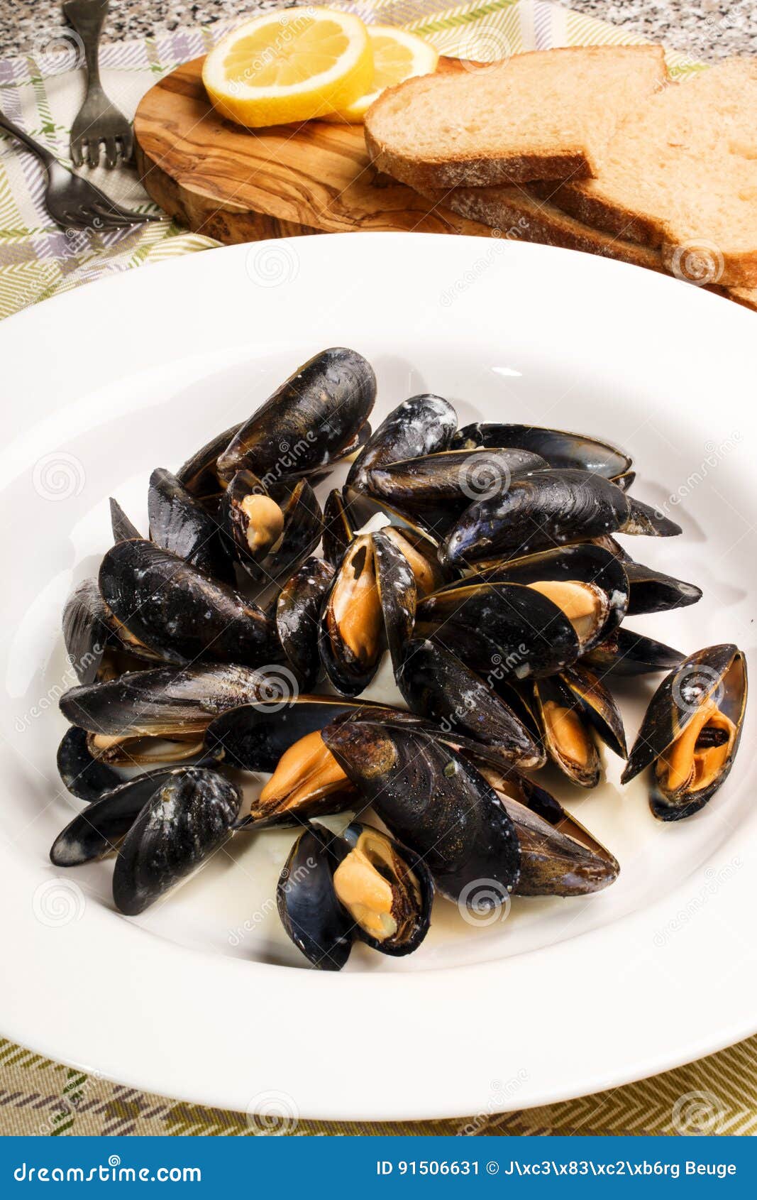 Mussels with Garlic and Butter Sauce in a Deep Plate Stock Image ...