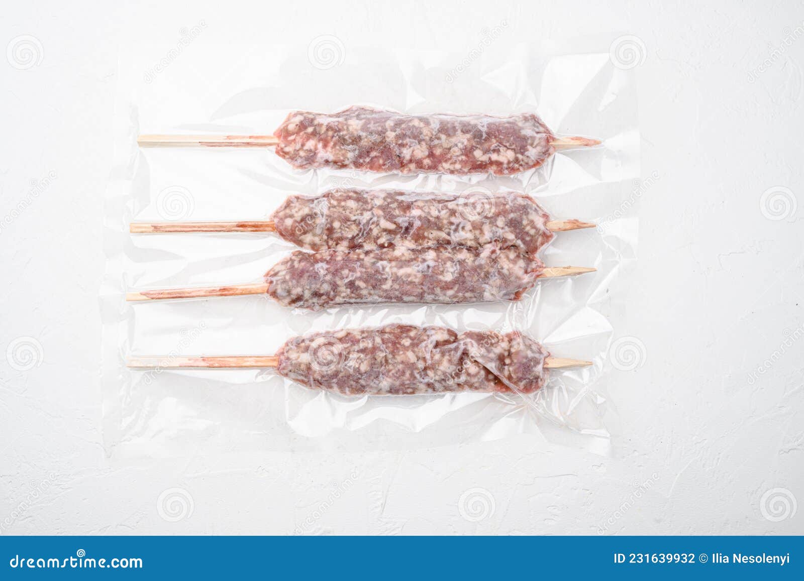 Mutton Minced Meat on Skewers in Vacuum Pack, on White Stone Table ...