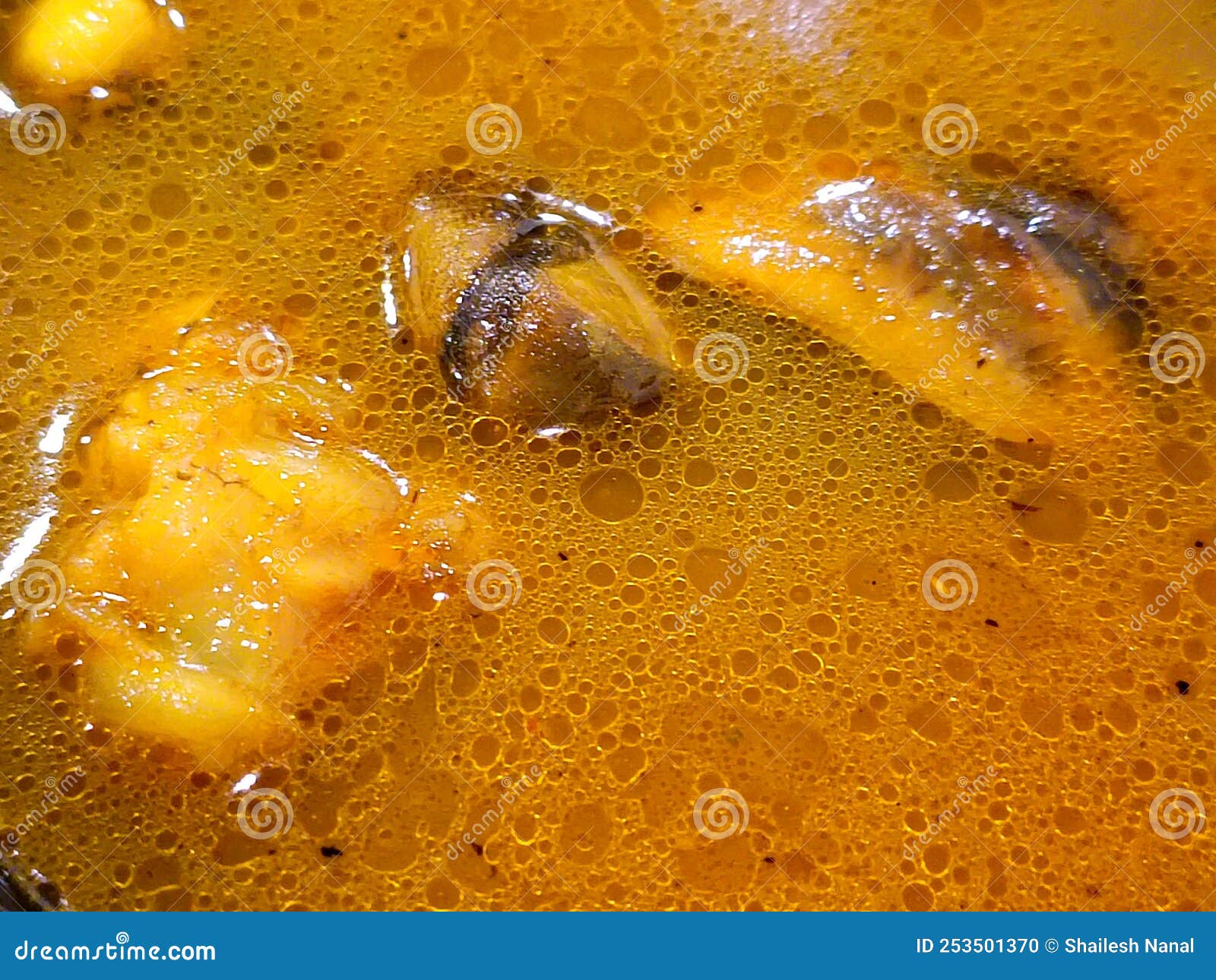 Mutton Pieces Dipped in Curry Stock Photo - Image of yellow, mutton ...