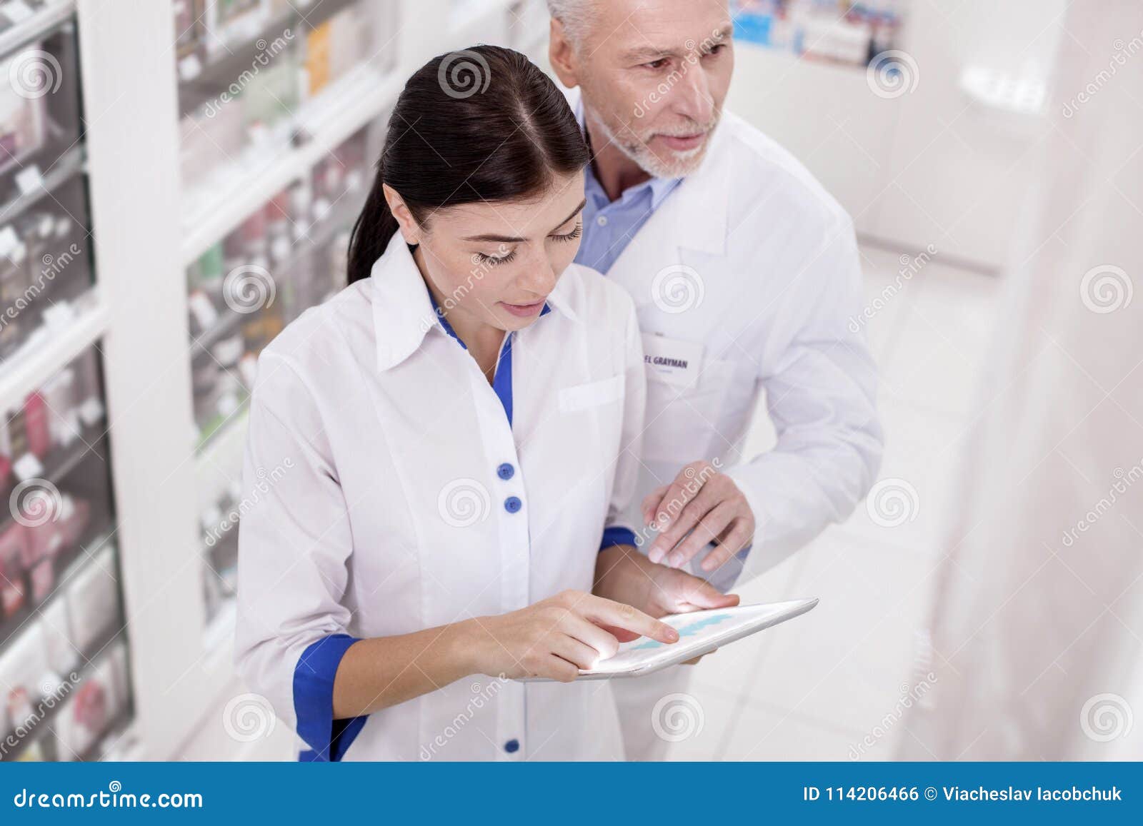 Pensive Two Pharmacists Helping Each Other Stock Photo - Image of ...