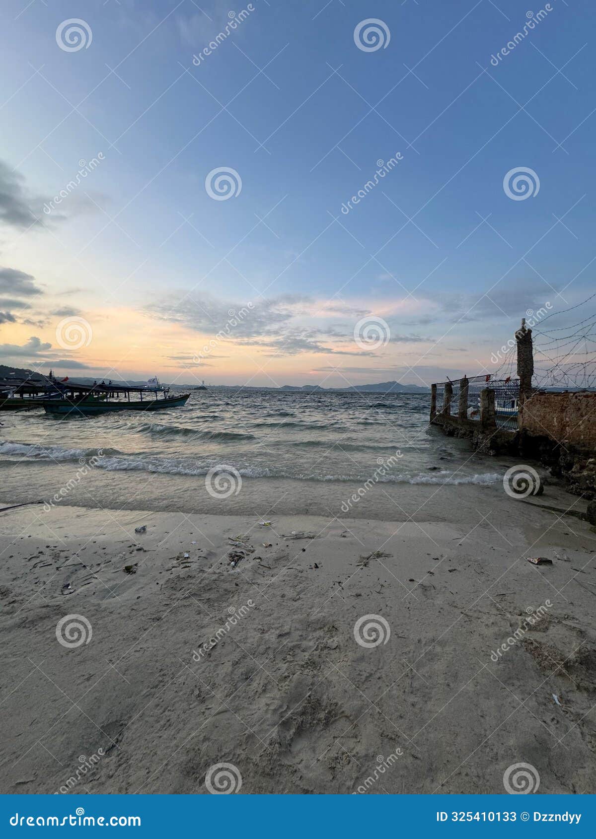 Mutun beach sunset stock image. Image of mutun, beach - 325410133
