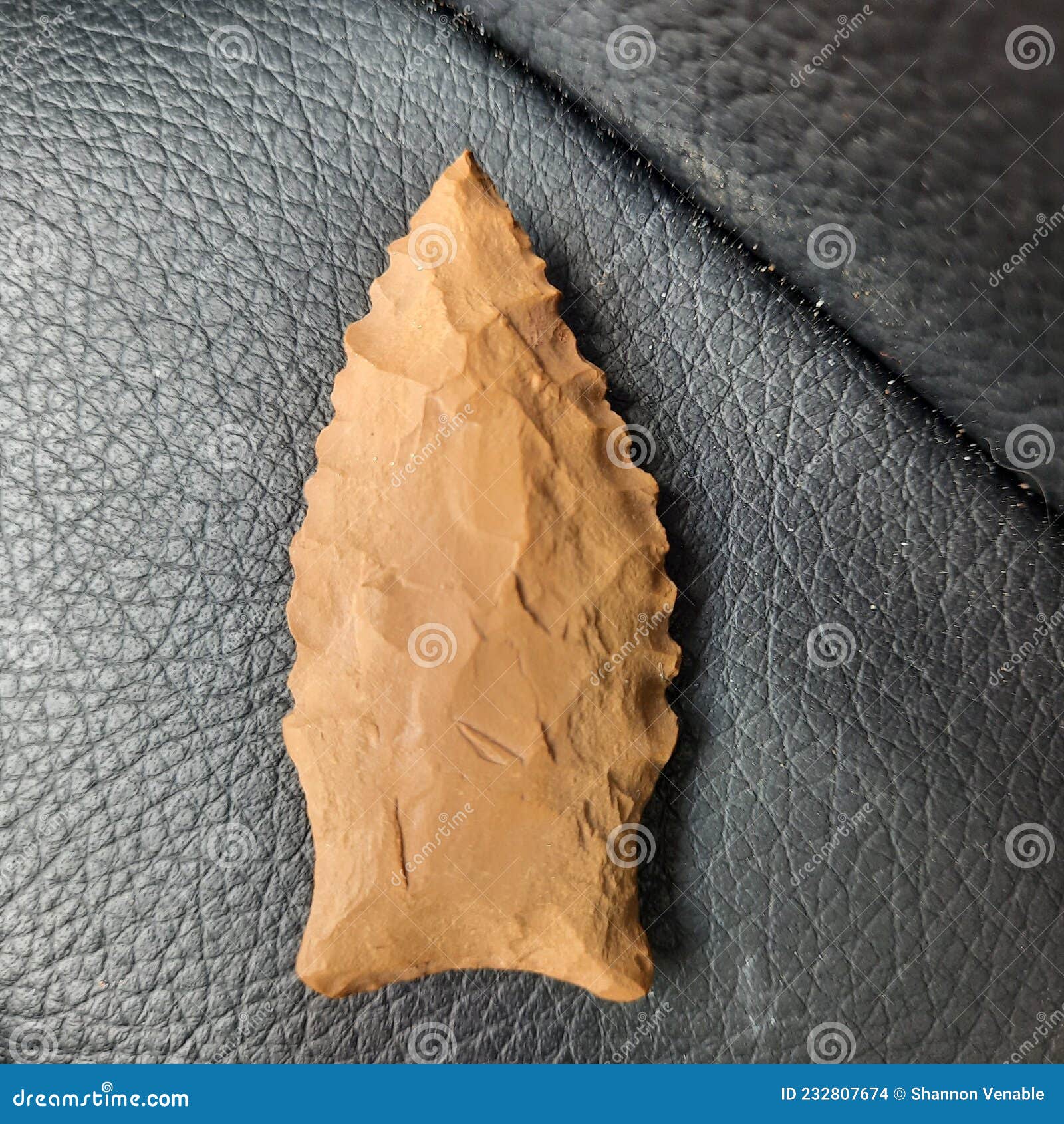 Arrowhead stock photo. Image of hand, circle, carving - 232807674