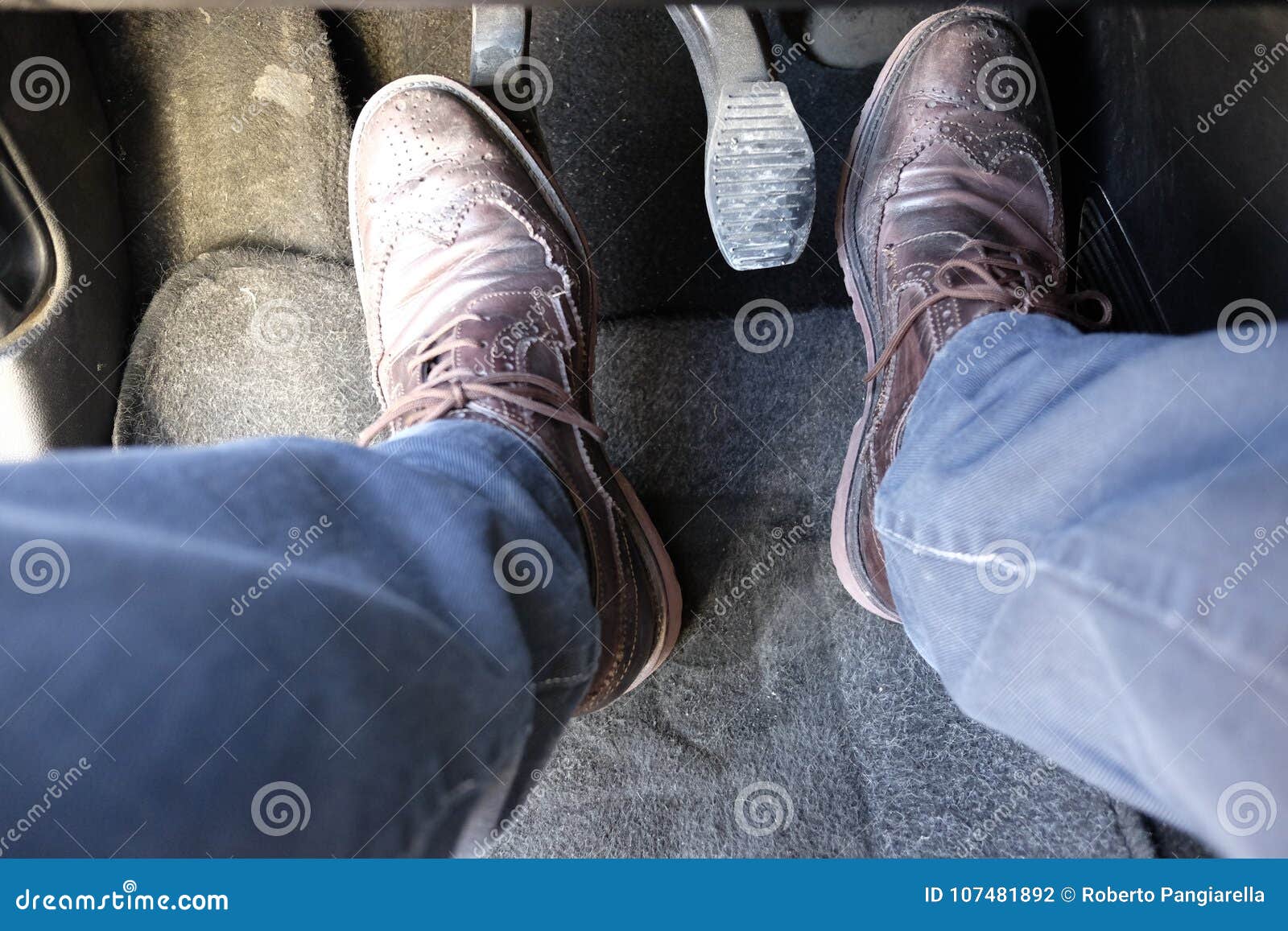 My legs driving the car stock photo. Image of control - 107481892