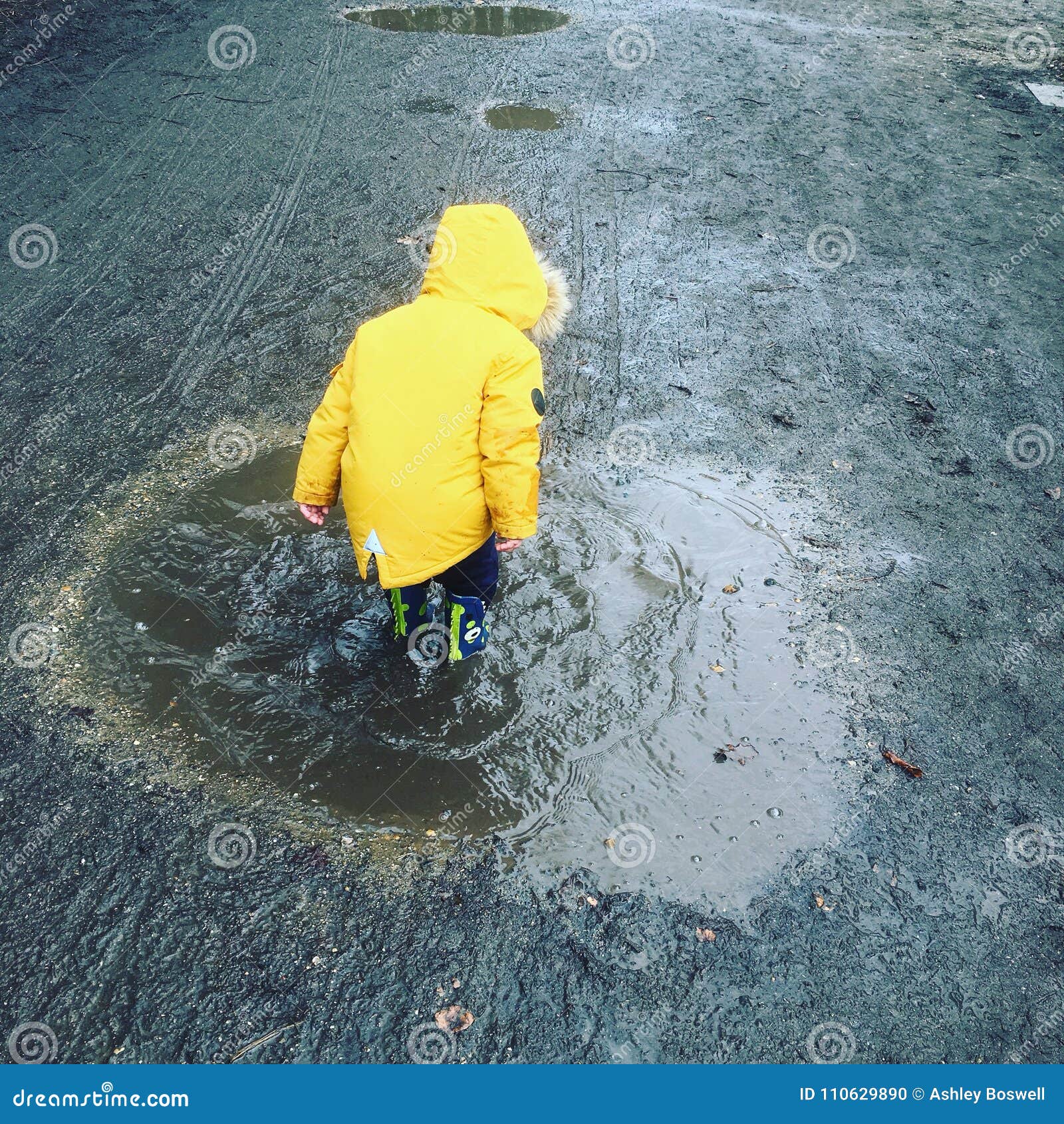 Jumping in puddles stock photo. Image of jumping, puddle - 110629890