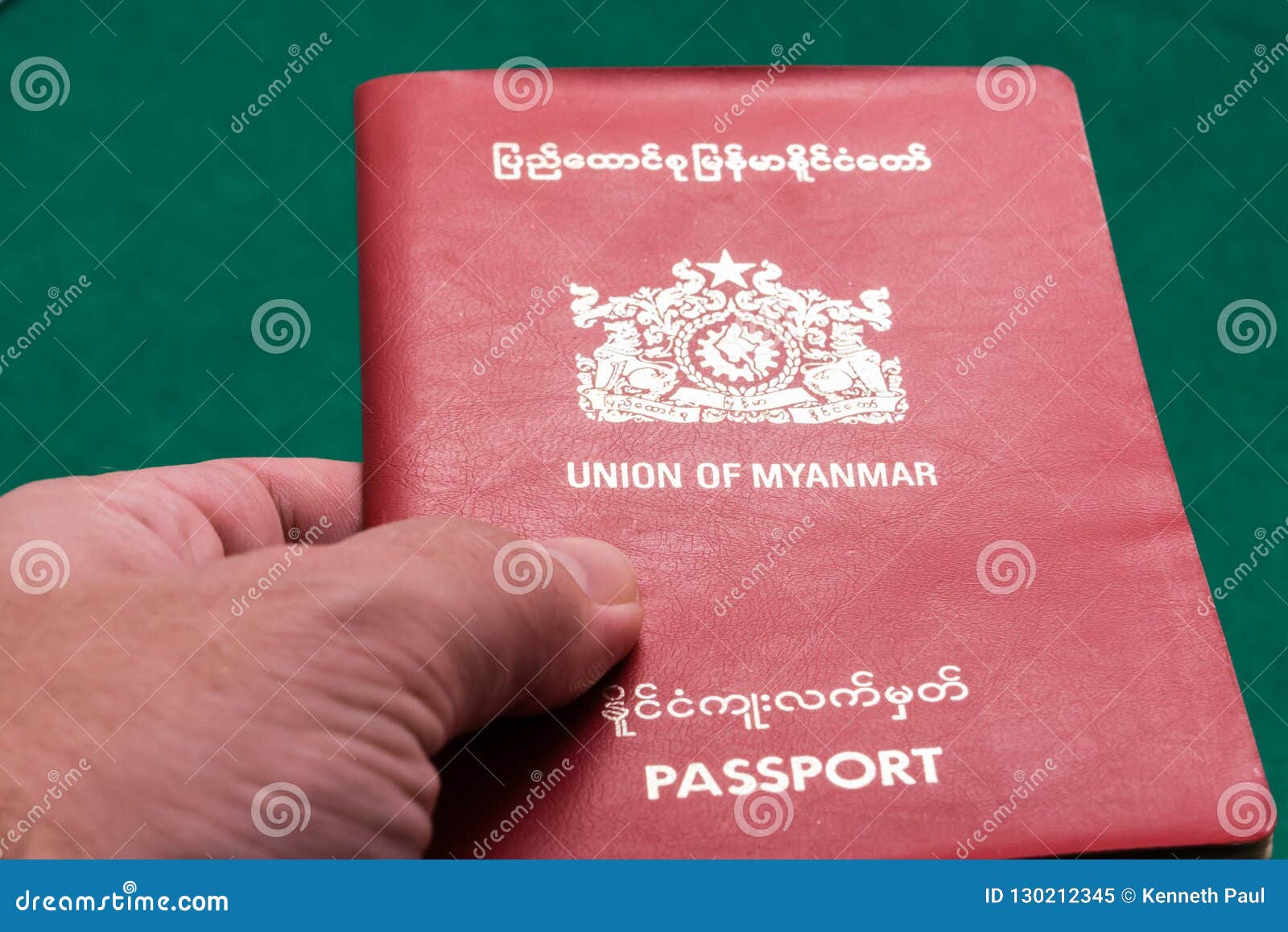 Myanmar passport in hand stock image. Image of concept - 130212345