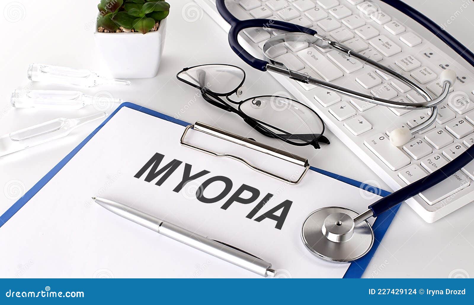 MYOPIA Text on White Paper on White Background. Stethoscope ,glasses ...