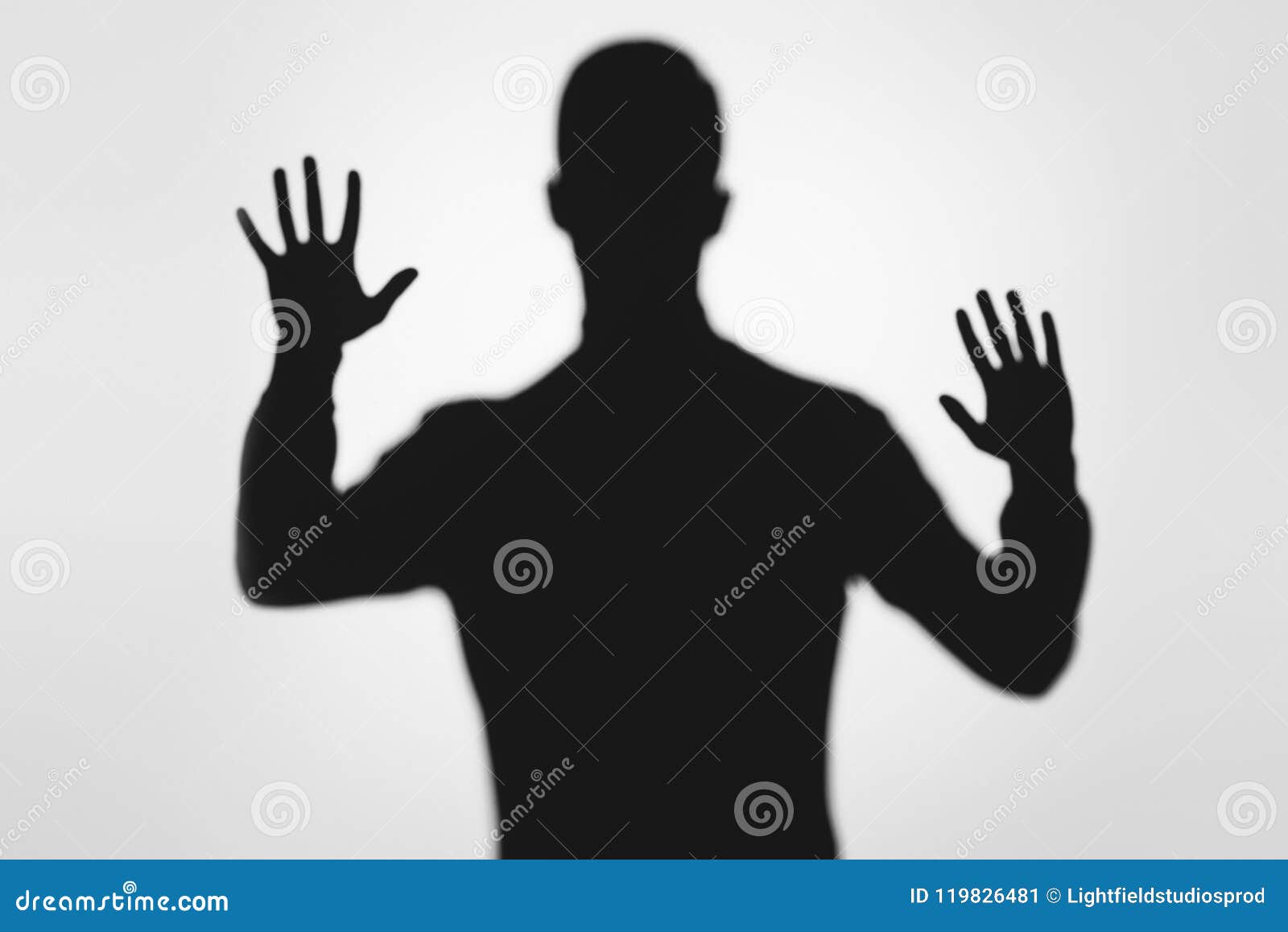Mysterious Blurry Shadow of Person Raising Hands on Grey Stock Image ...