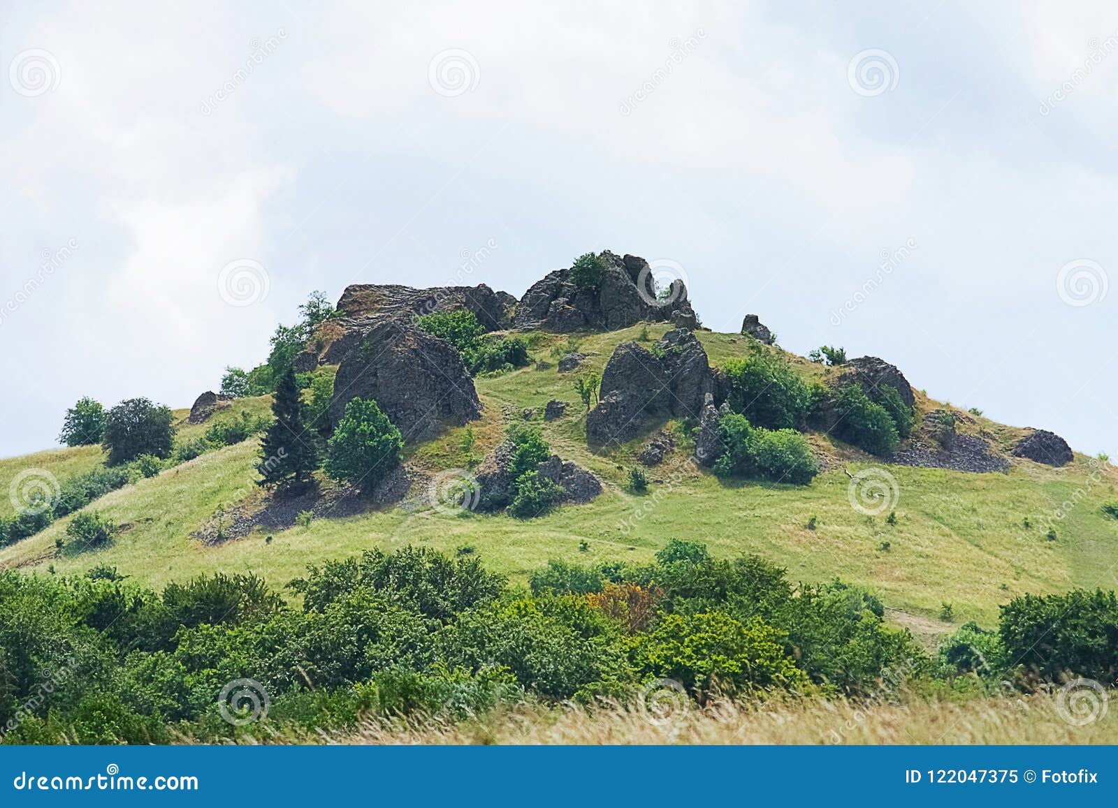 Mysterious Hill Landscape with Rocks,meadows and Trees Stock Image ...