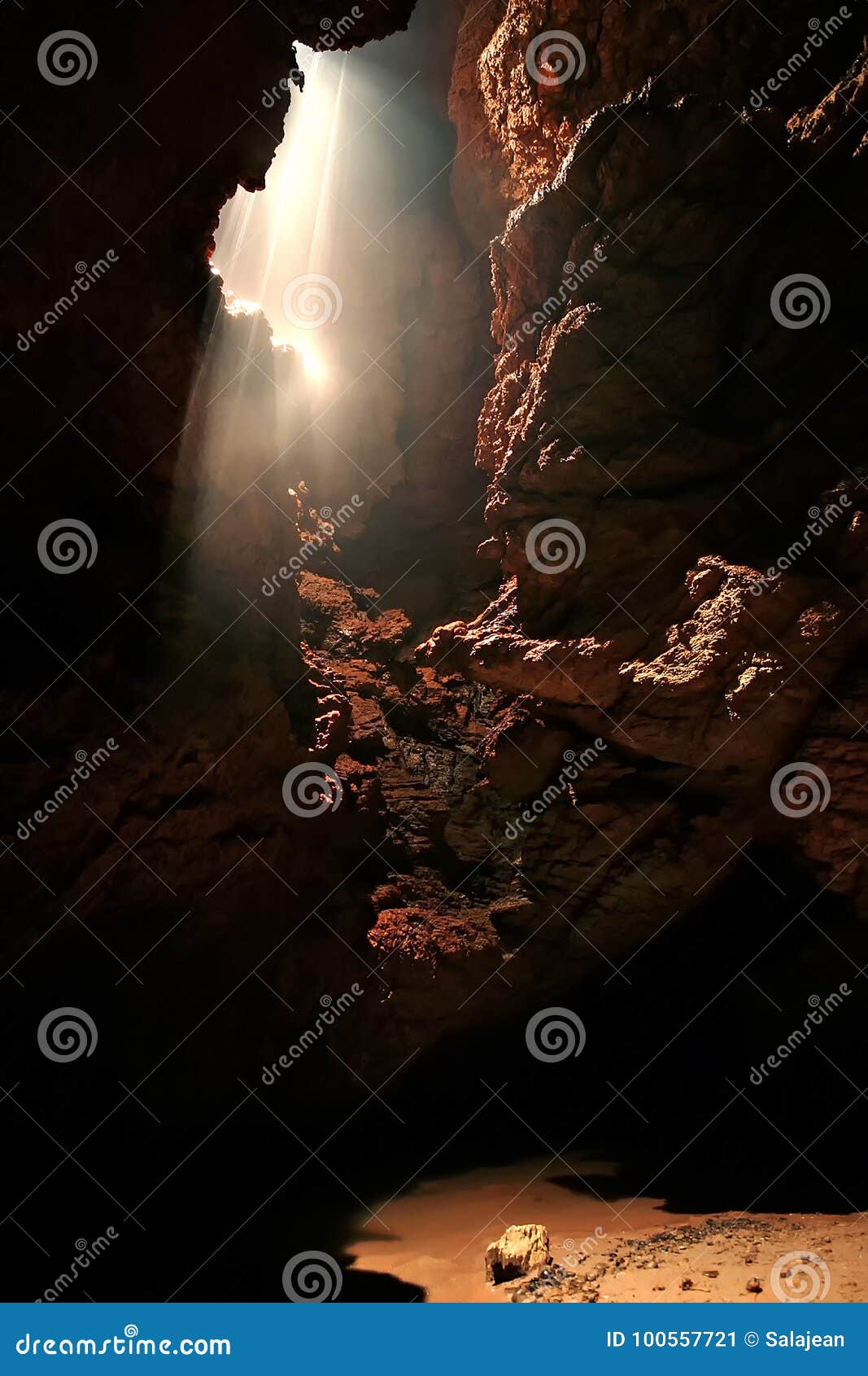Mysterious light in a cave stock image. Image of geological - 100557721