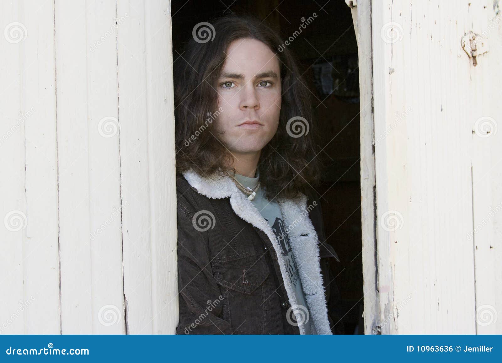 Mysterious Looking Young Man Stock Photo - Image of coat, rustic: 10963636