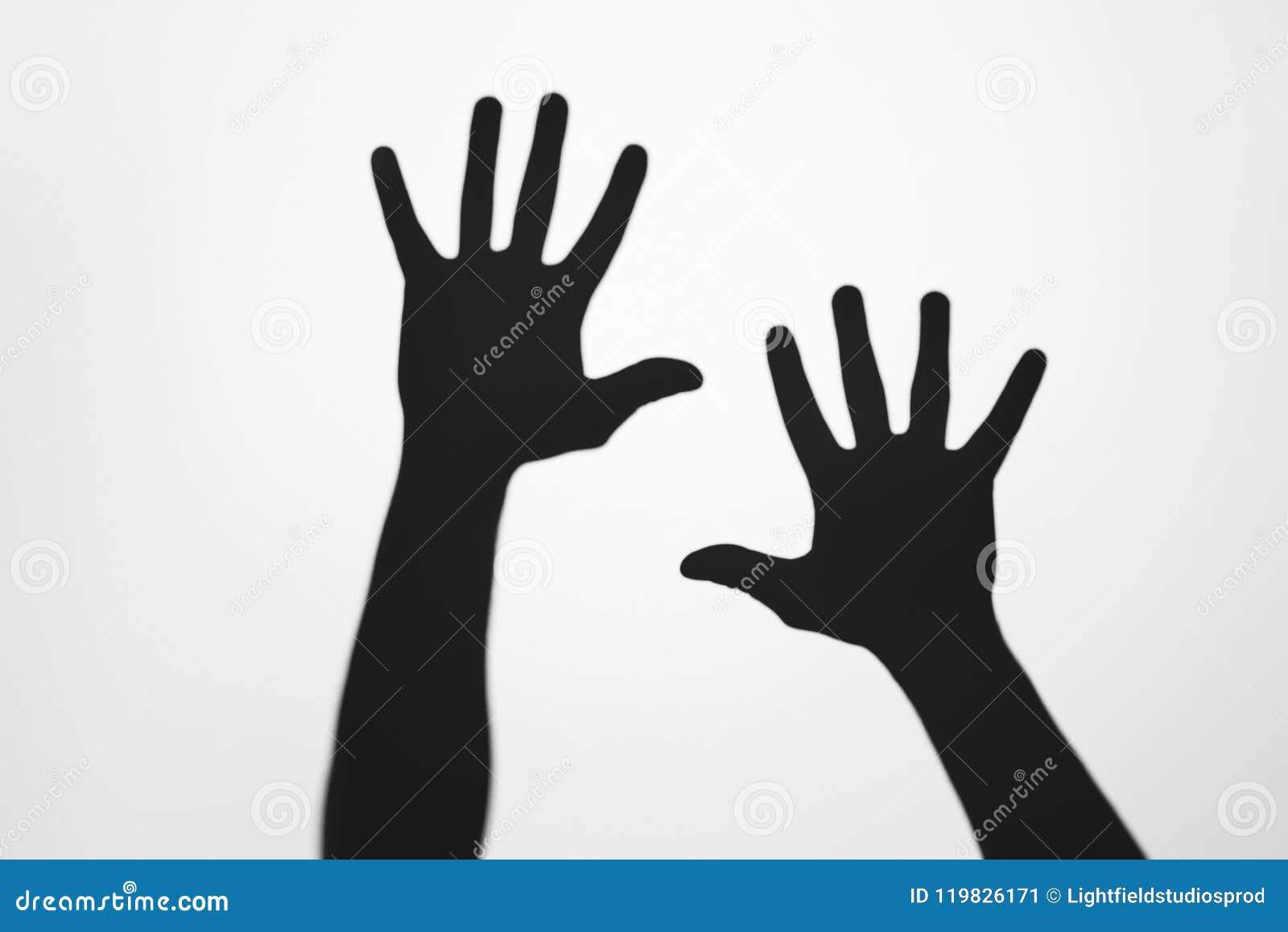Mysterious Shadows of Human Hands on Grey Stock Image - Image of ...