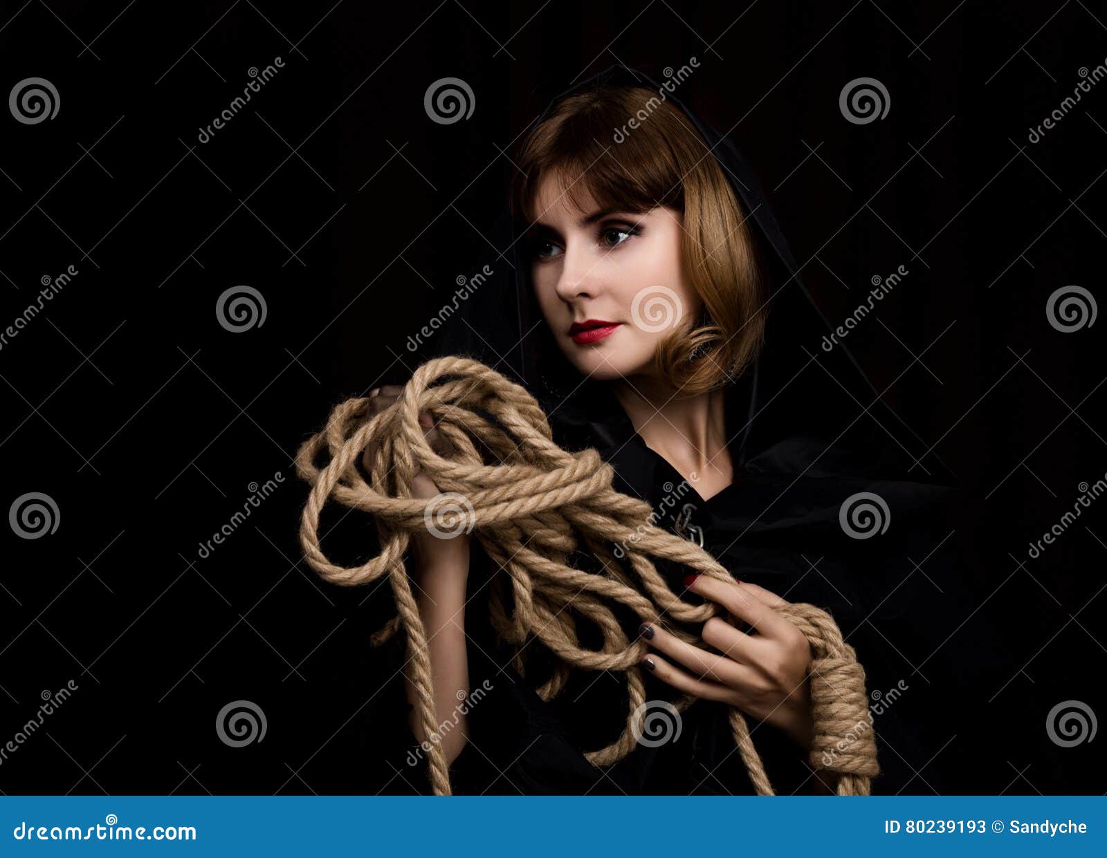 Mysterious Young Woman Holding Loop of the Rope. on a Dark Background ...
