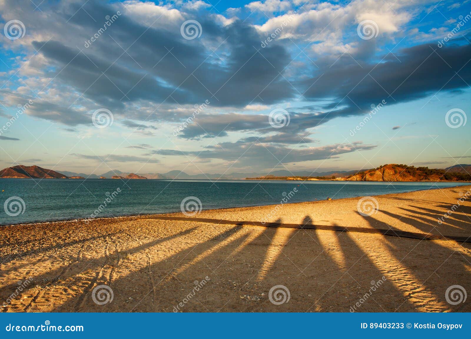 Mystical Shadows On Sandy Sea Beach In Dawn Sky Background Royalty-Free ...