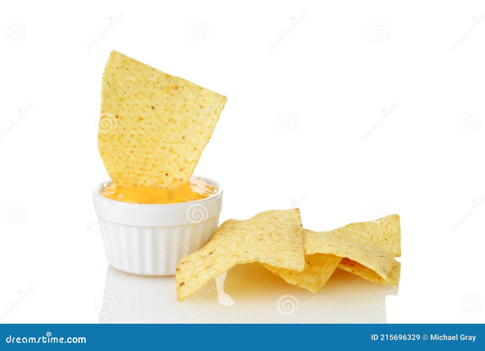 Nacho Chip Dipped in Bowl of Cheese Stock Image - Image of sauce ...