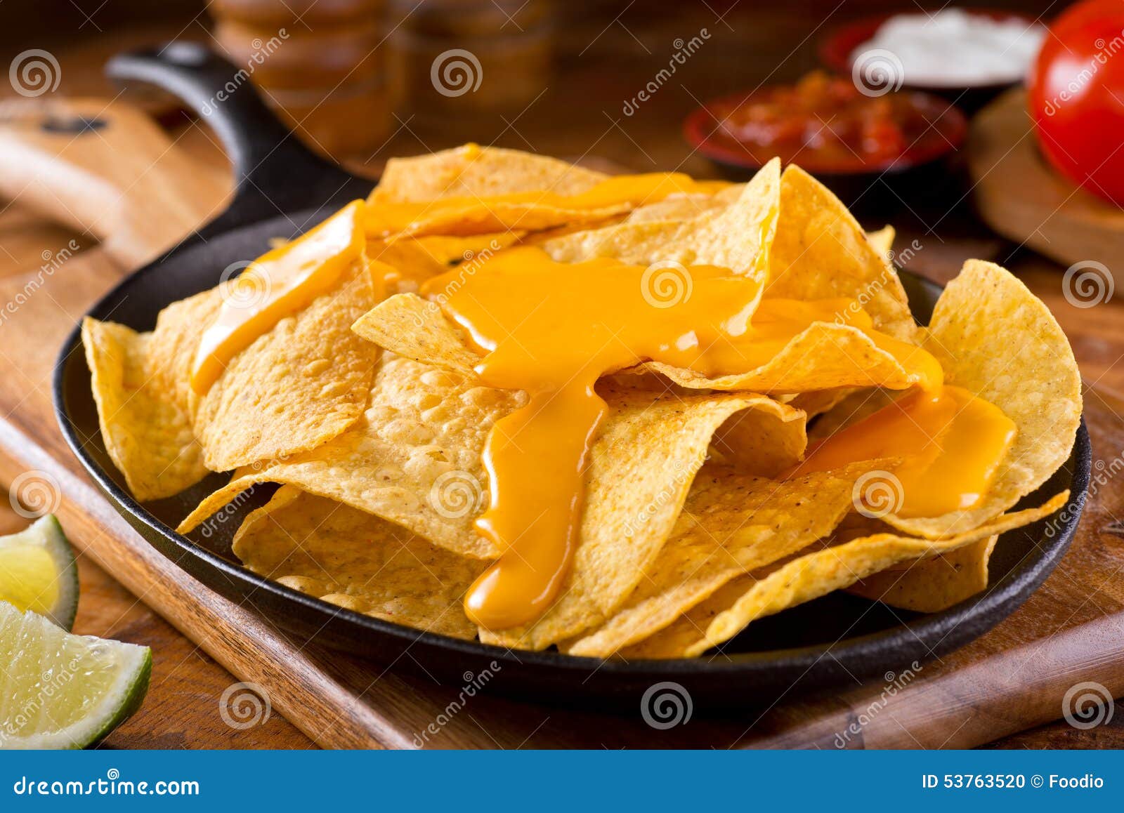 Nachos with Cheese Sauce stock photo. Image of tomato - 53763520