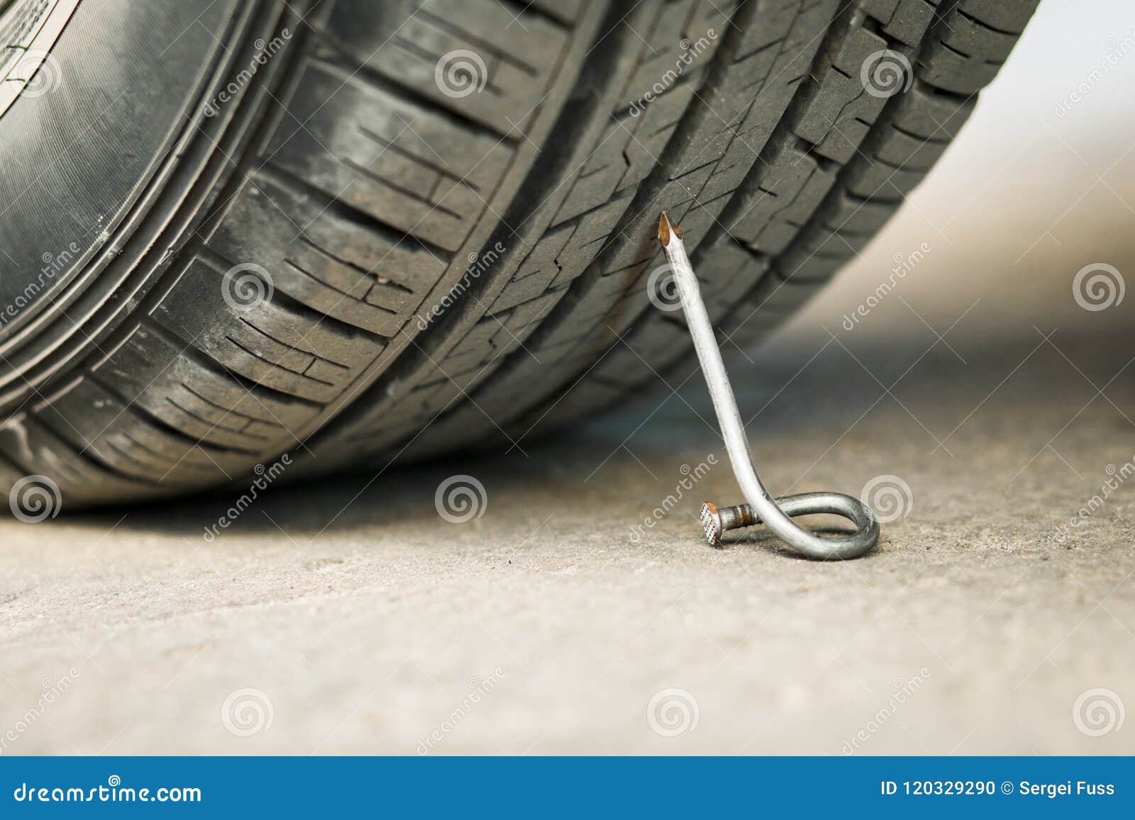 Nail on an Asphalt Road with a Car. Stock Photo - Image of auto ...