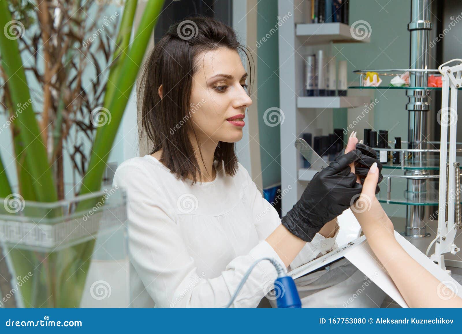 Nail Master Manicures Nails in a Beauty Salon Stock Photo - Image of ...