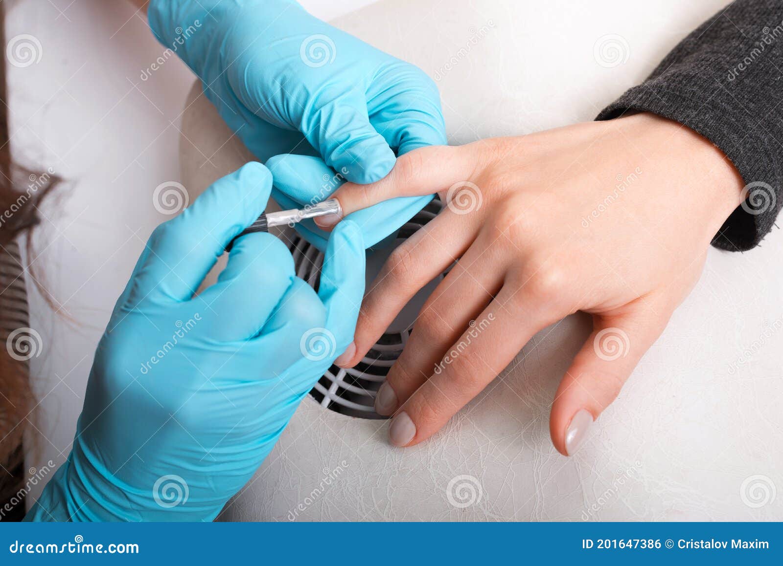 A Nail Master is Painting a Womans Nails with Grey Stock Photo - Image ...